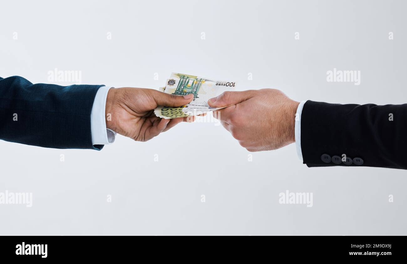 Fear corrupts. a businessman taking money from another man against a ...