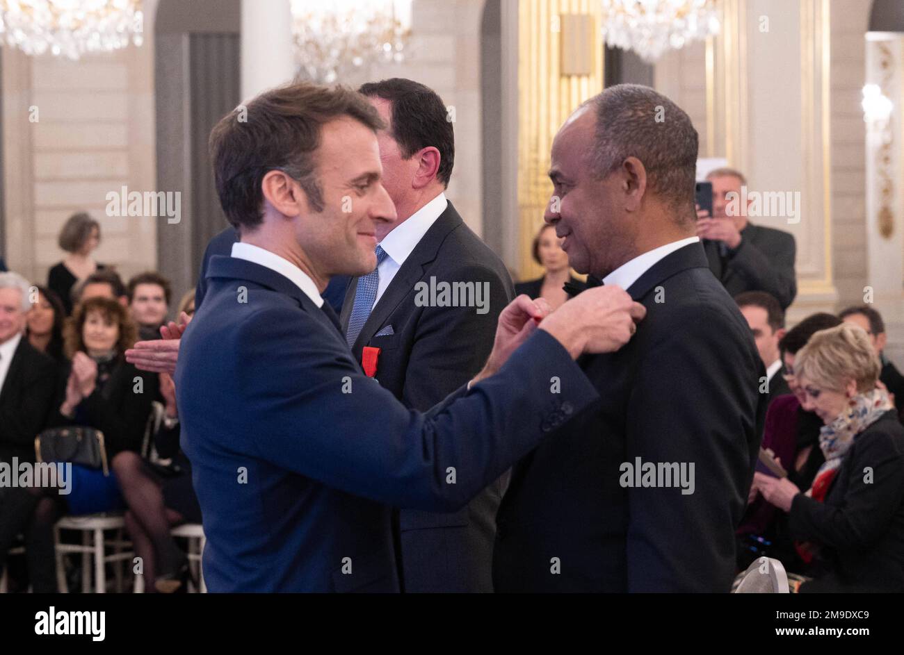 Paris, France. 17th Jan, 2023. President Emmanuel Macron embraces ...