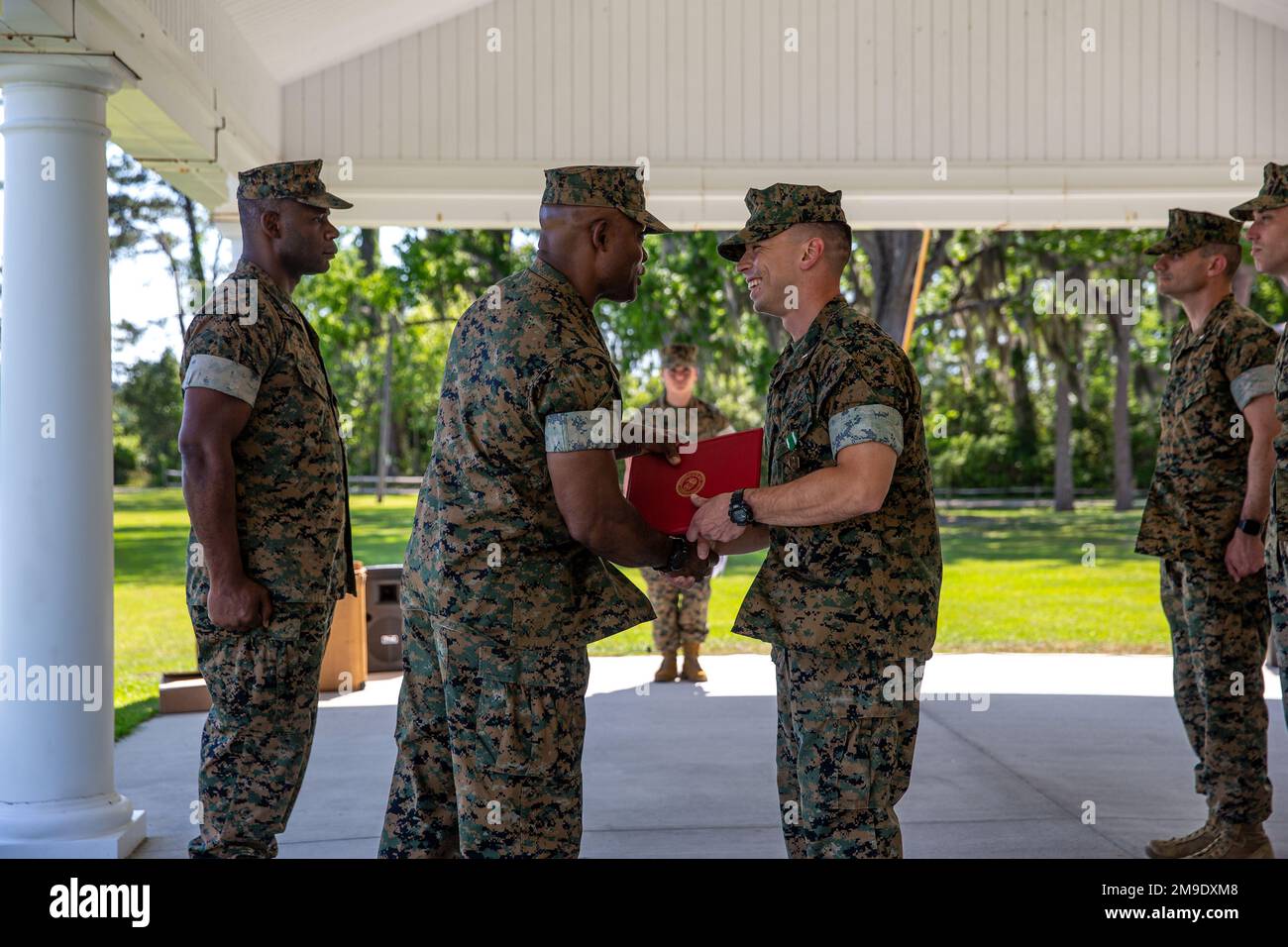 U.S. Marine Corps Brig. Gen. Anthony Henderson presents a Navy ...