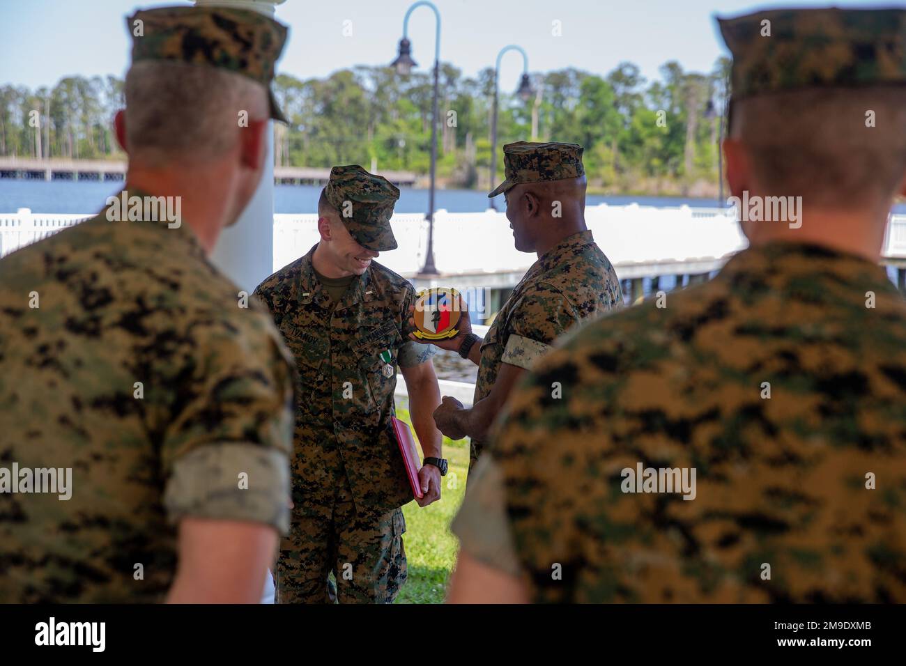 U.S. Marine Corps Brig. Gen. Anthony Henderson presents a Navy ...