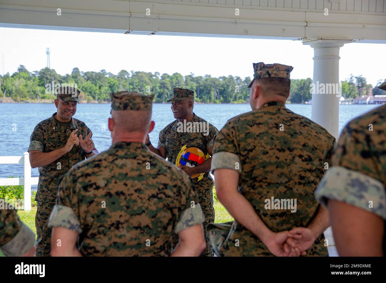 U.S. Marine Corps Brig. Gen. Anthony Henderson presents a commemorative ...