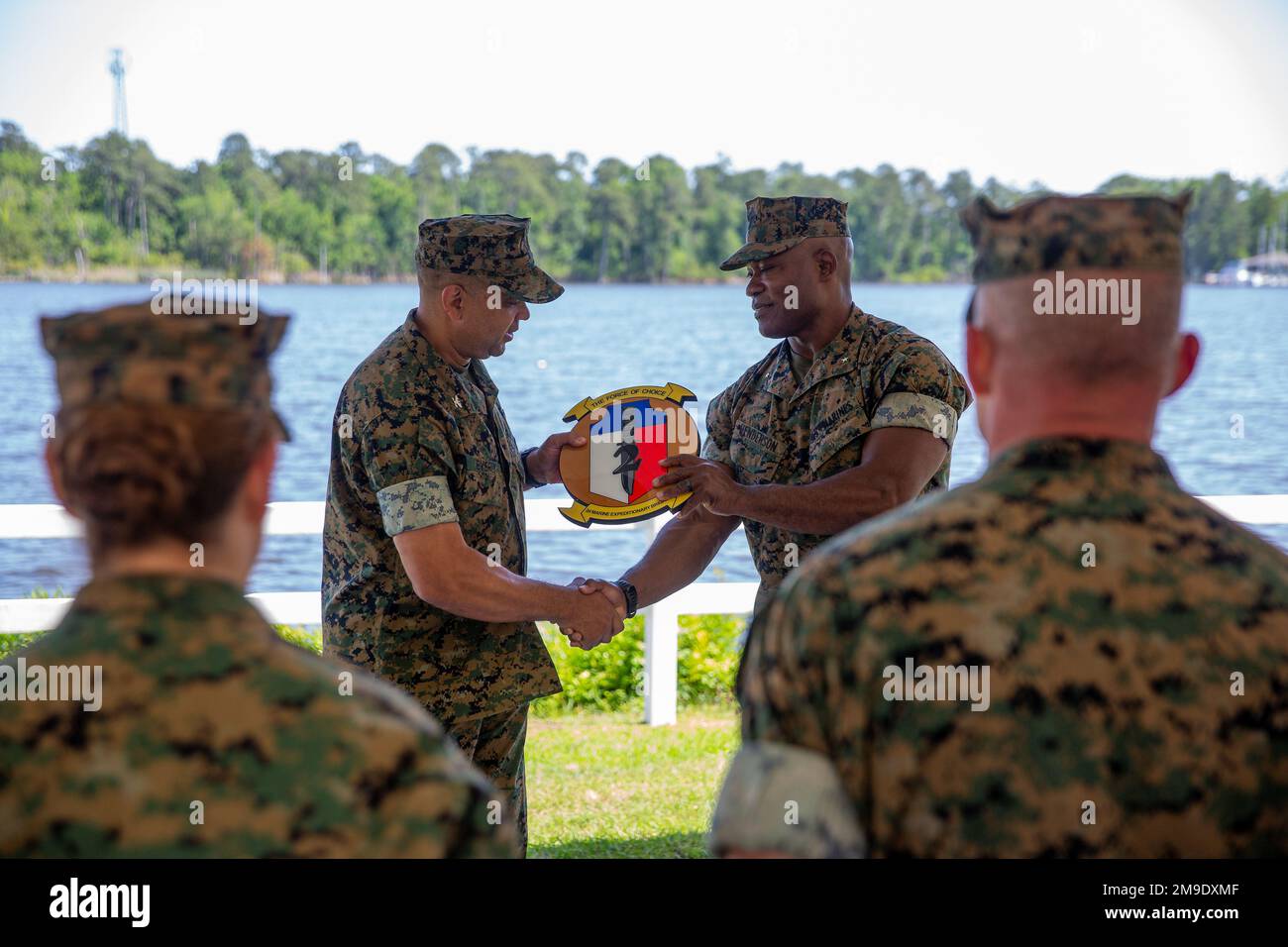 U.S. Marine Corps Brig. Gen. Anthony Henderson presents a commemorative ...