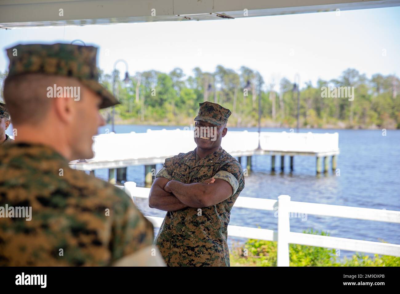 U.S. Marine Corps Col. David Everly presents a commemorative plaque to ...