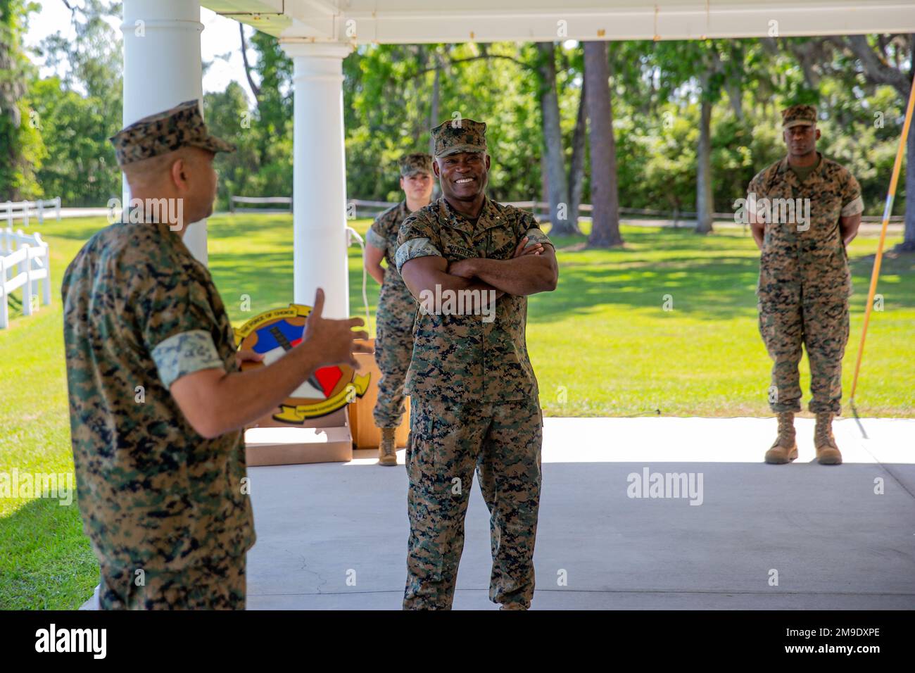U.S. Marine Corps Brig. Gen. Anthony Henderson presents a commemorative ...