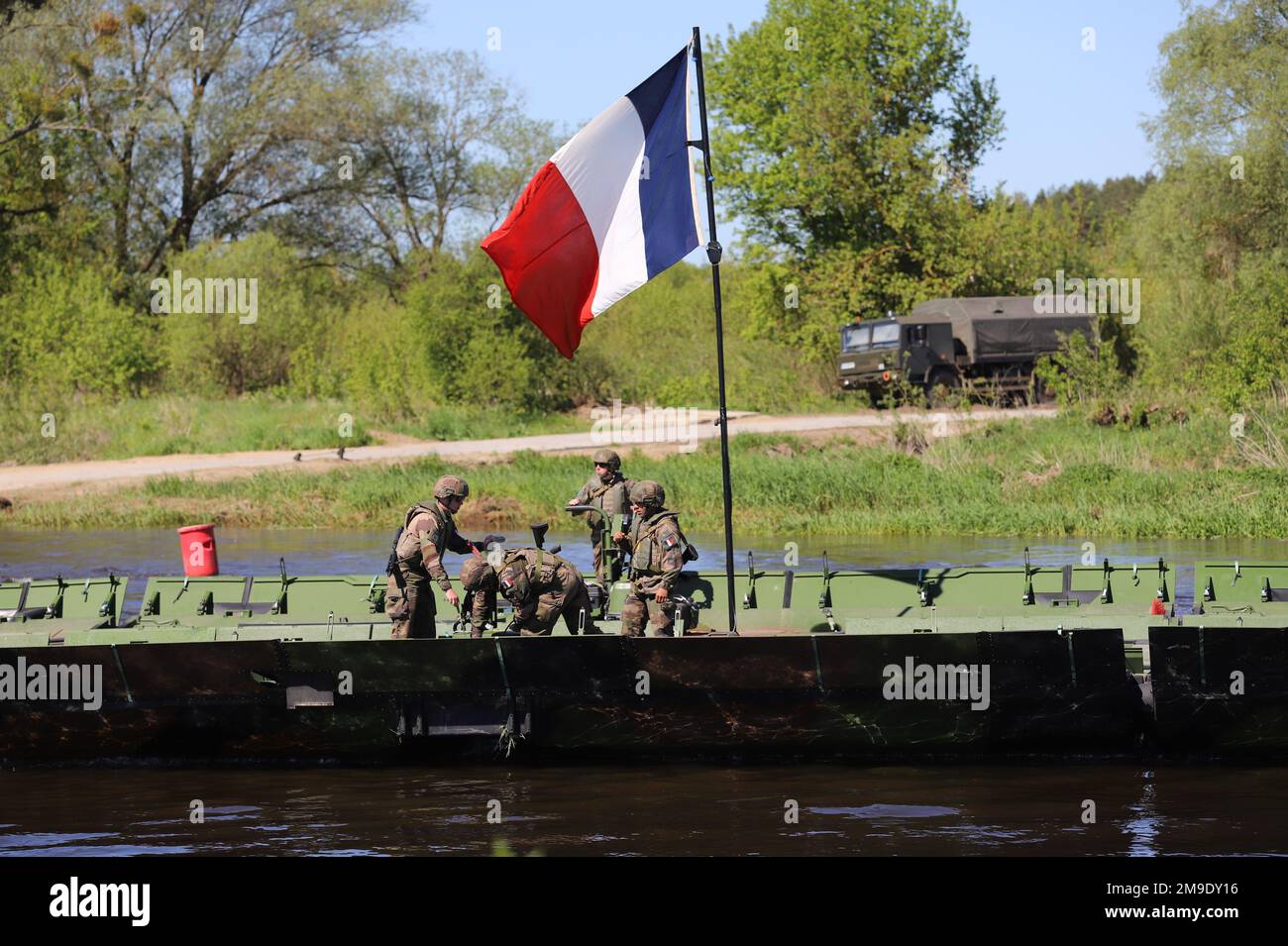 French soldiers begin to move a Motorized Floating Bridge (PFM) on the ...