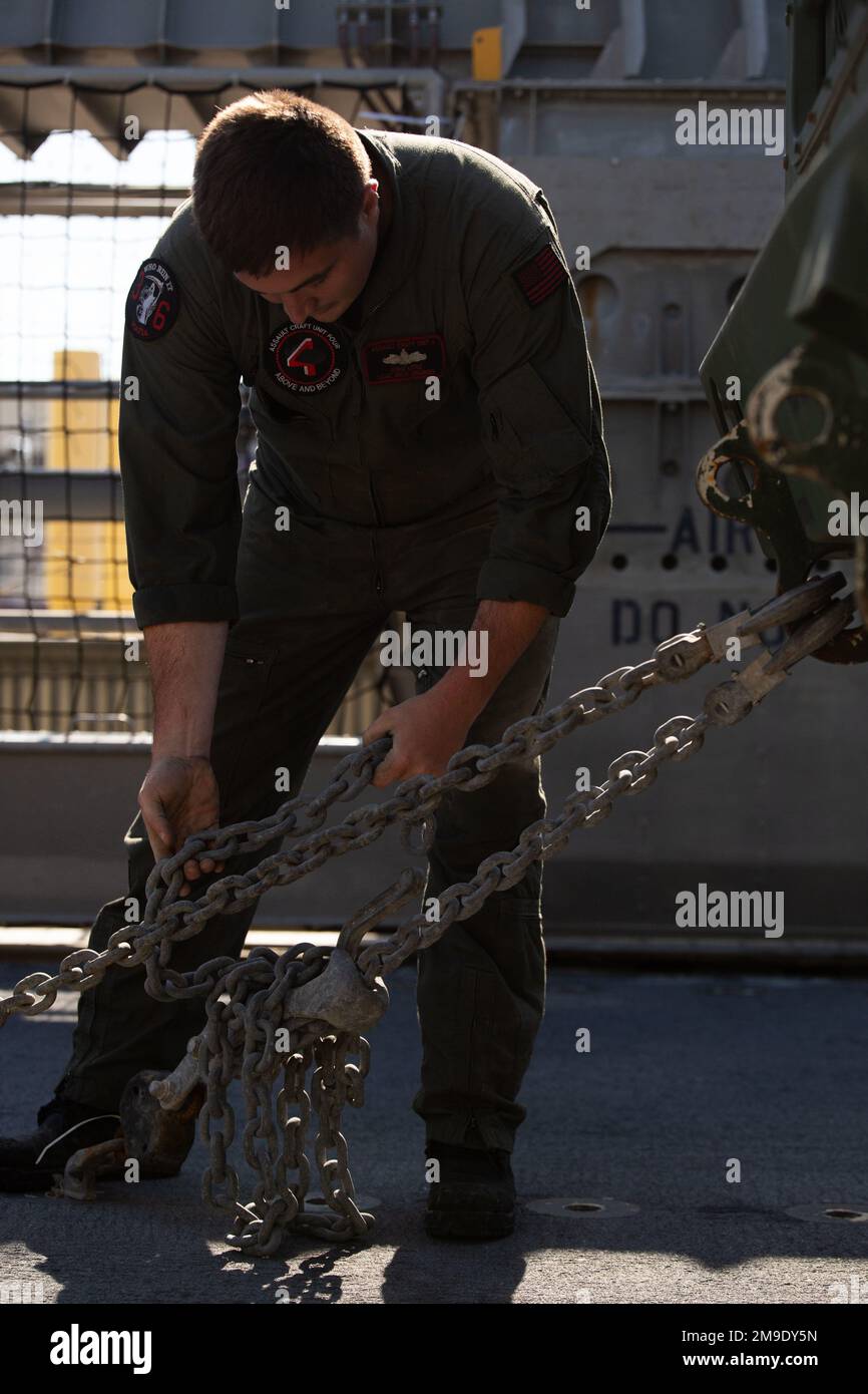 U.S. Navy Seaman Johnaton Little, a ramp marshall with Beachmaster Unit ...