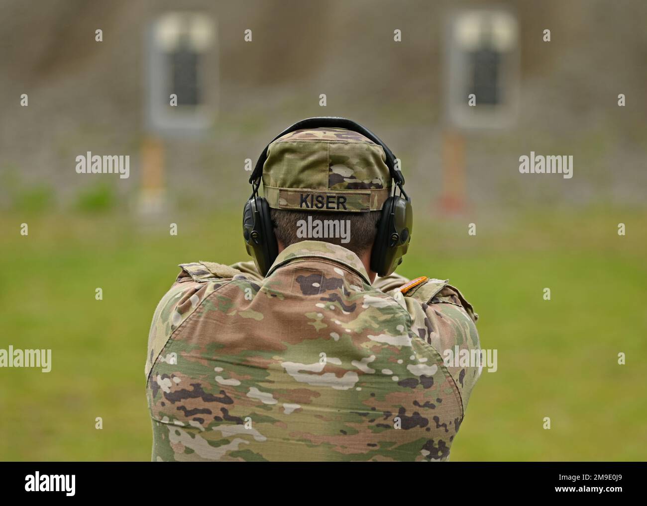 A U.S. Soldier with the 42nd Military Police Brigade fires a pistol ...