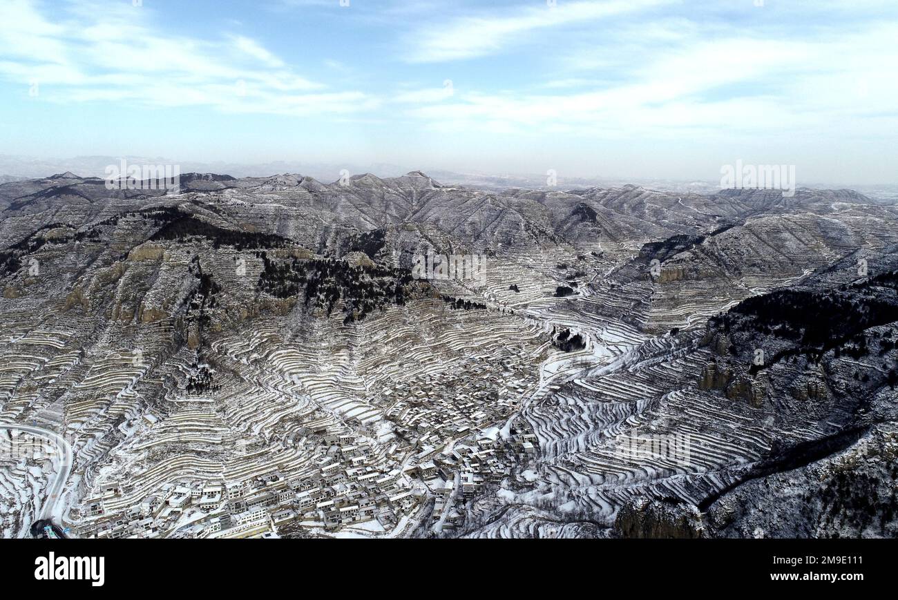 Aerial photo shows the scenery of terraced fields after snow in She ...
