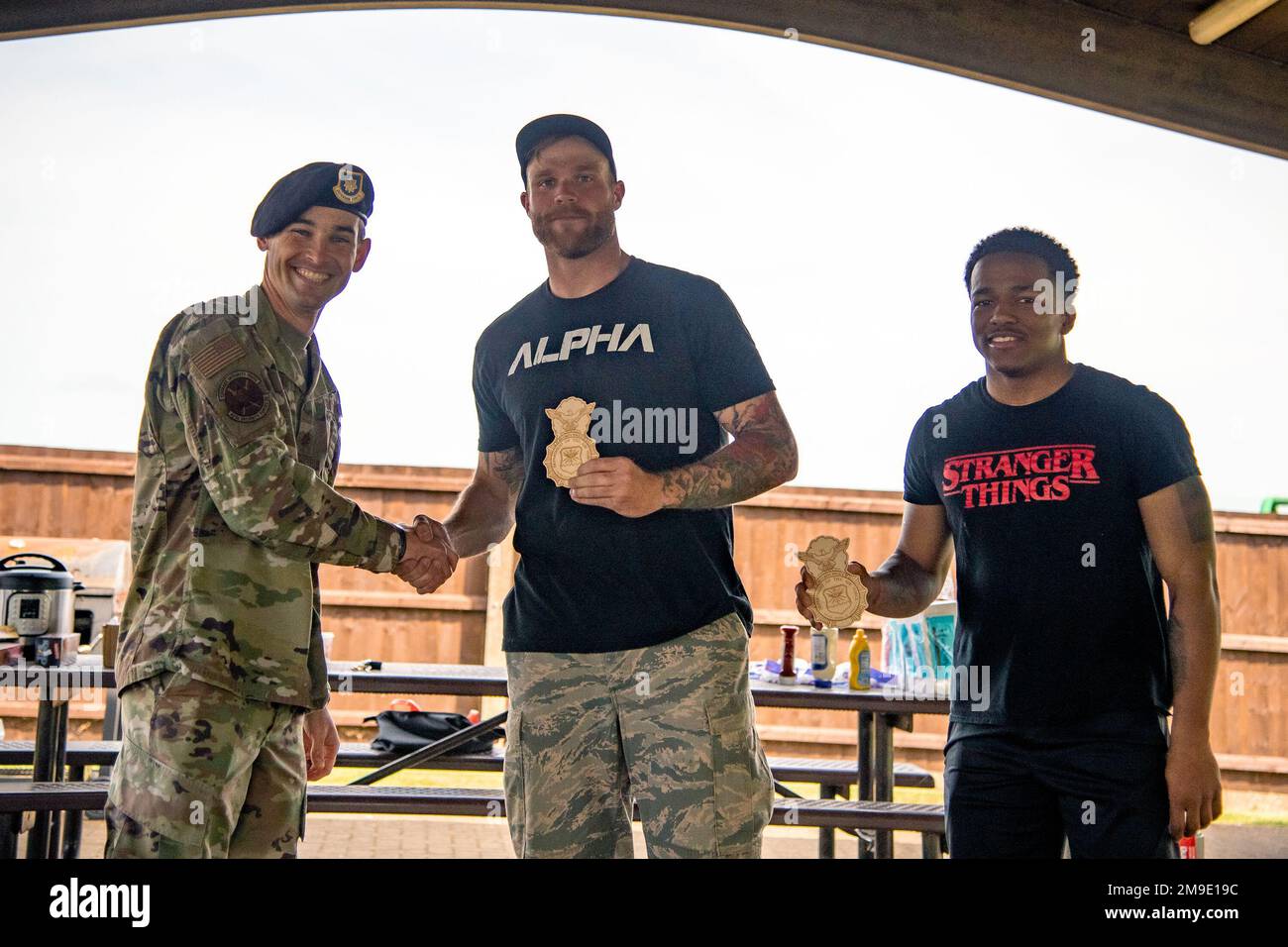 U.S. Air Force Maj. Daniel Merkh, left, 423d Security Forces Squadron commander, awards Senior ...