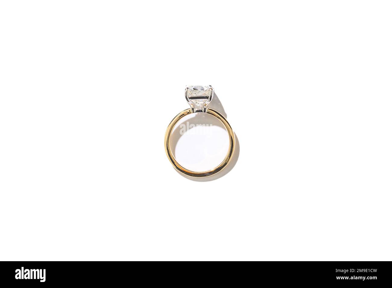 A diamond and gold engagement ring isolated on a white background Stock ...