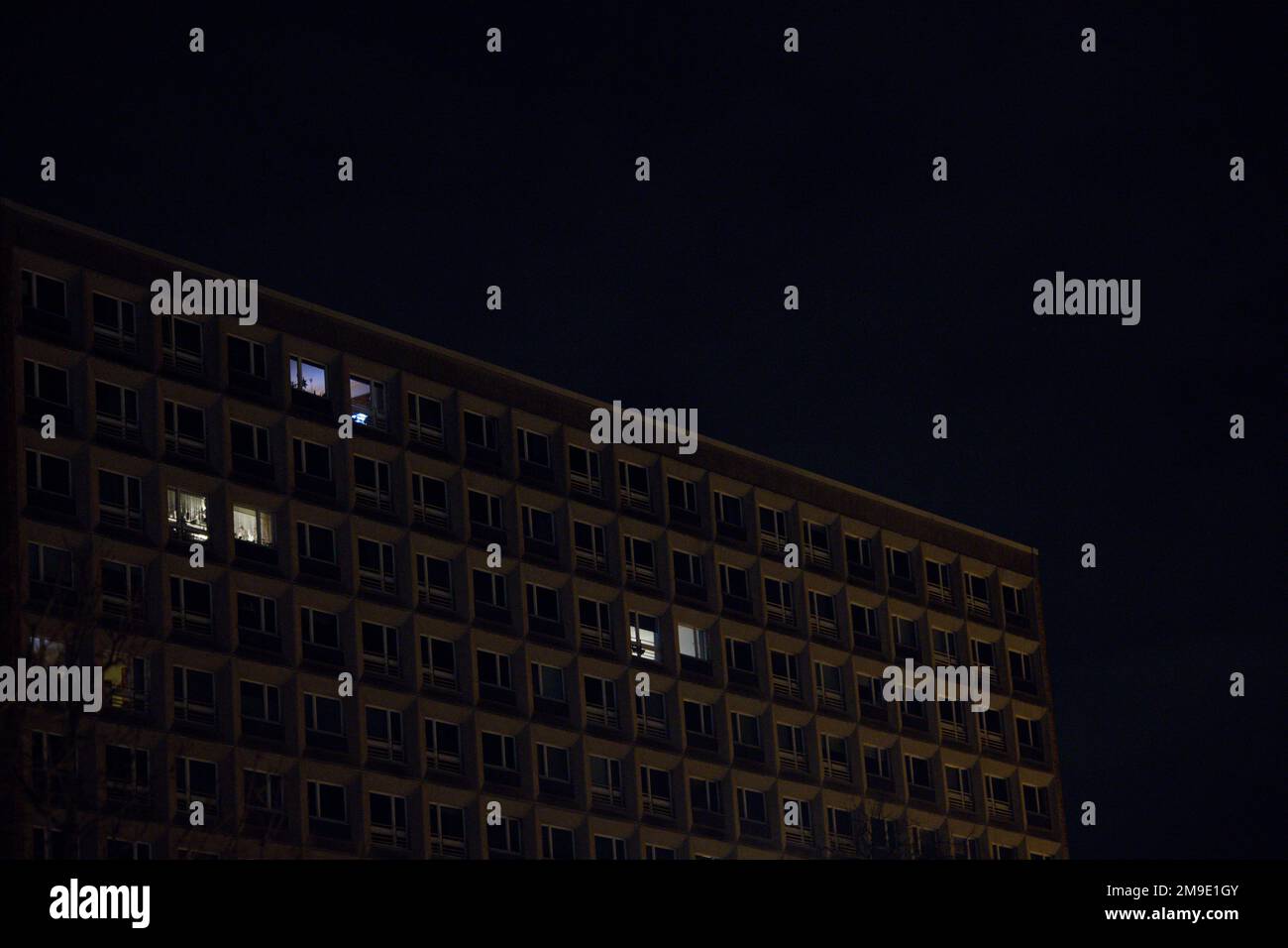 Berlin, Germany. 18th Jan, 2023. Windows are lit in an apartment ...