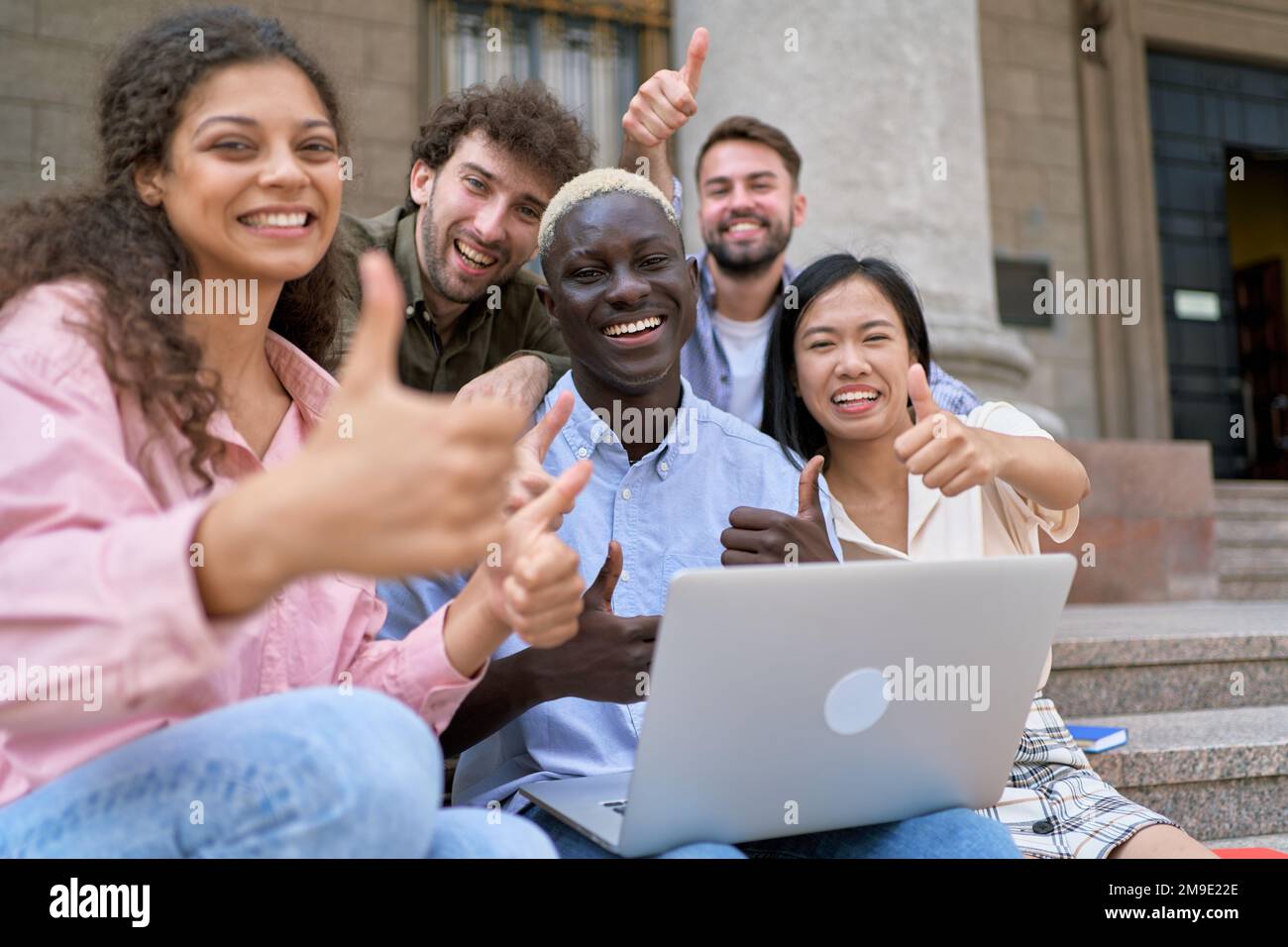 multicultural group of students showing thumbs up. close-up Stock Photo - Alamy
