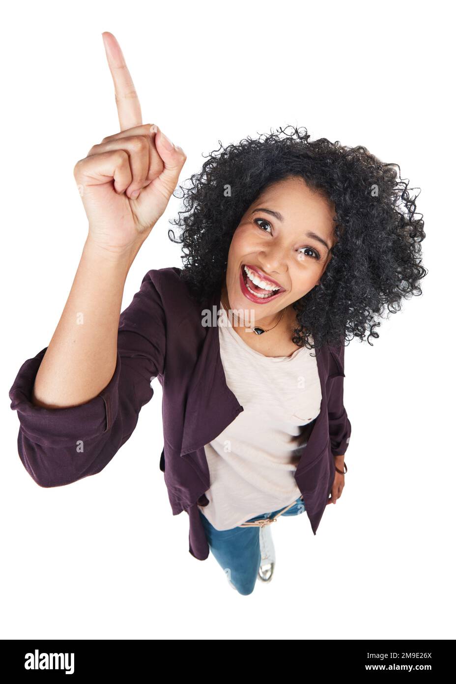 Portrait, pointing and excited with a model black woman in studio ...