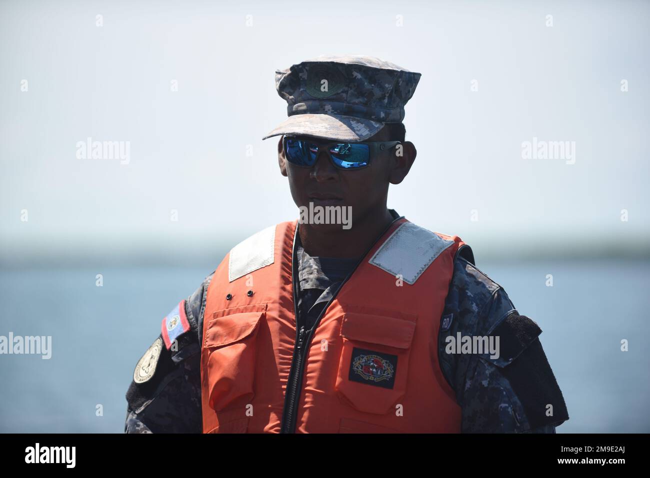 A member of the Belize coast guard observes at-sea boarding exercises ...