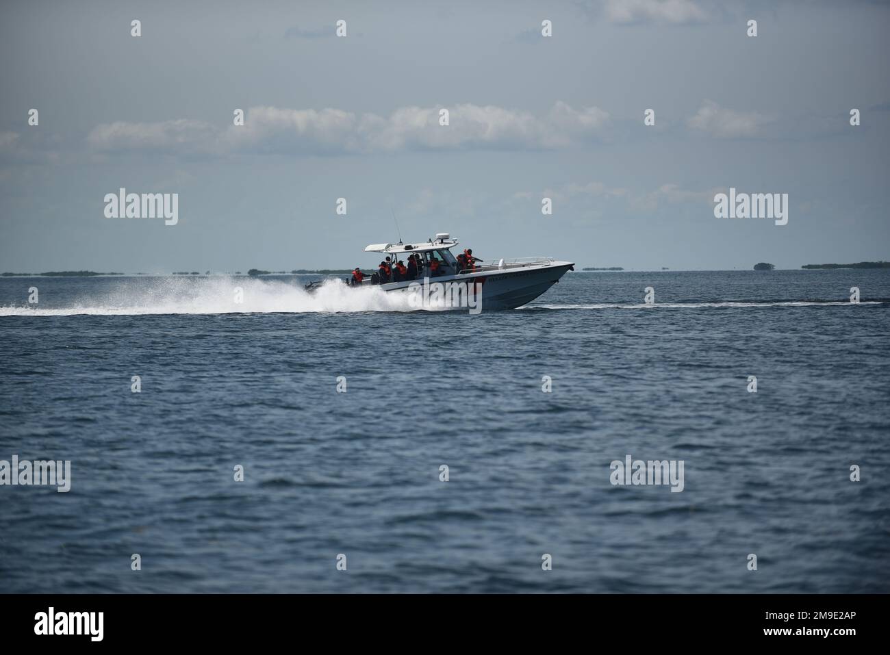 A Belize coast guard vessel takes off in pursuit of another vessel ...