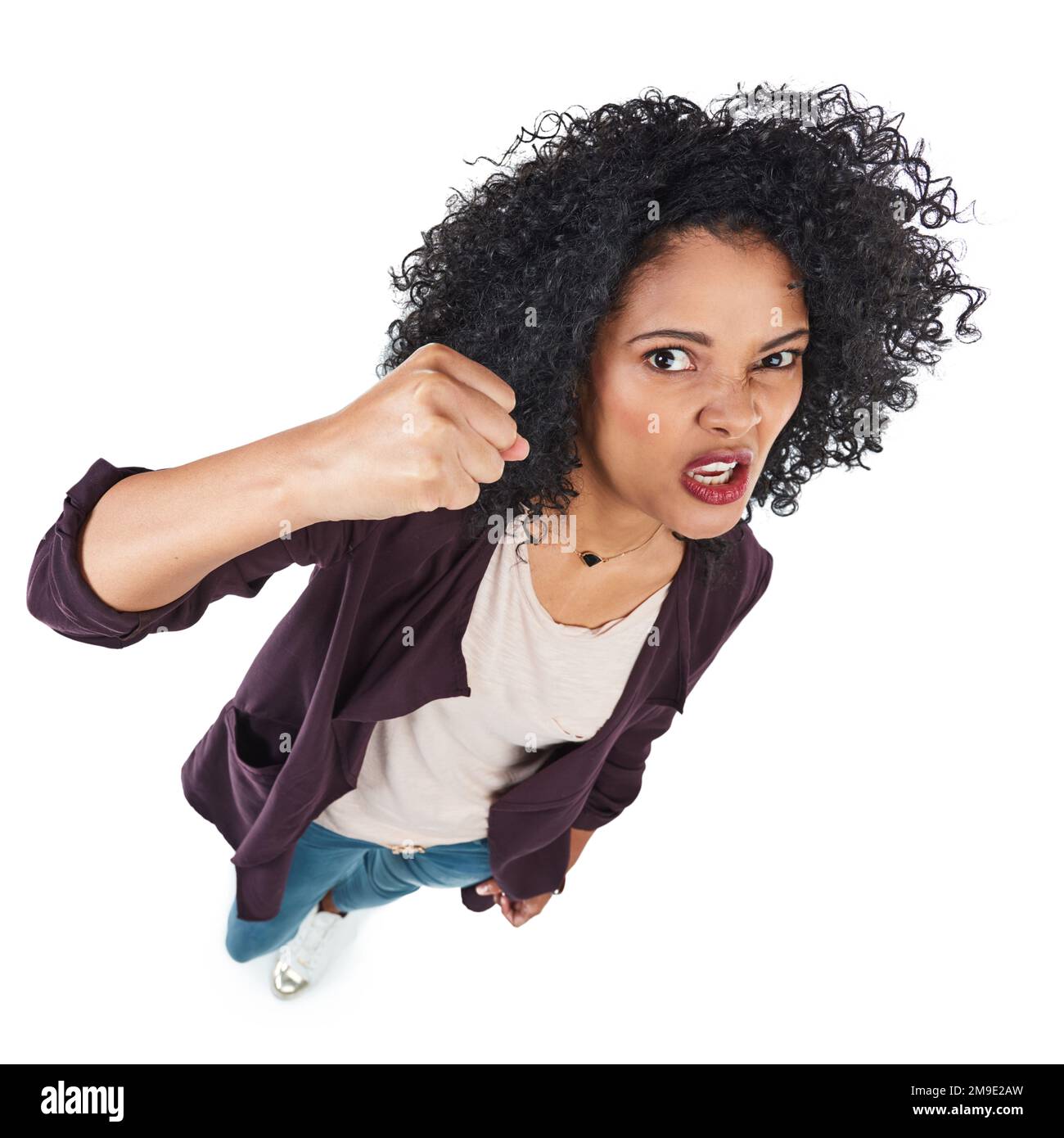 Angry, crazy and portrait of a black woman with a fist for a fight ...