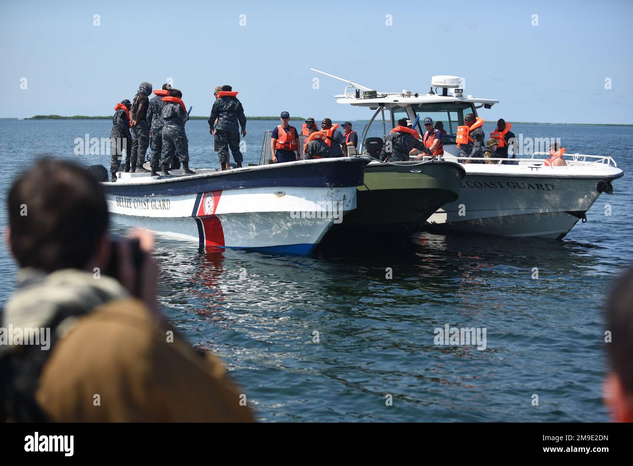 Local media observe the at-sea boarding exercises conducted by members ...