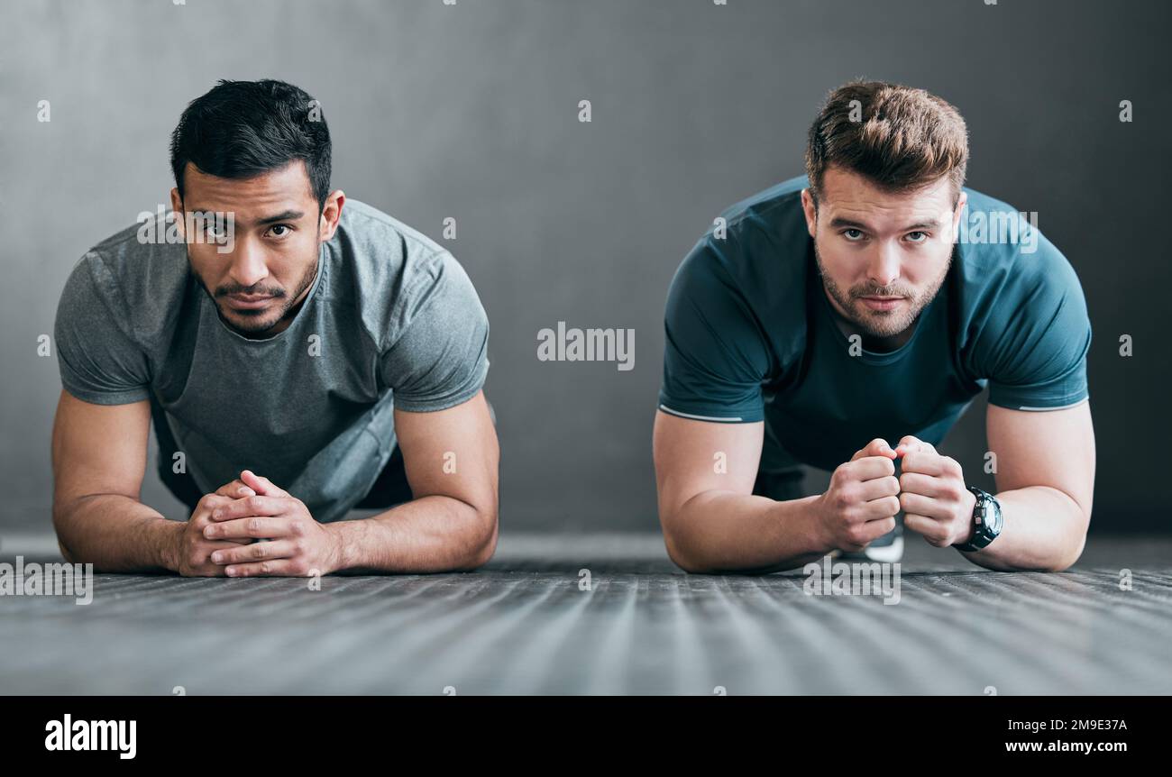 Pushing each other further. Full length portrait of two handsome young ...