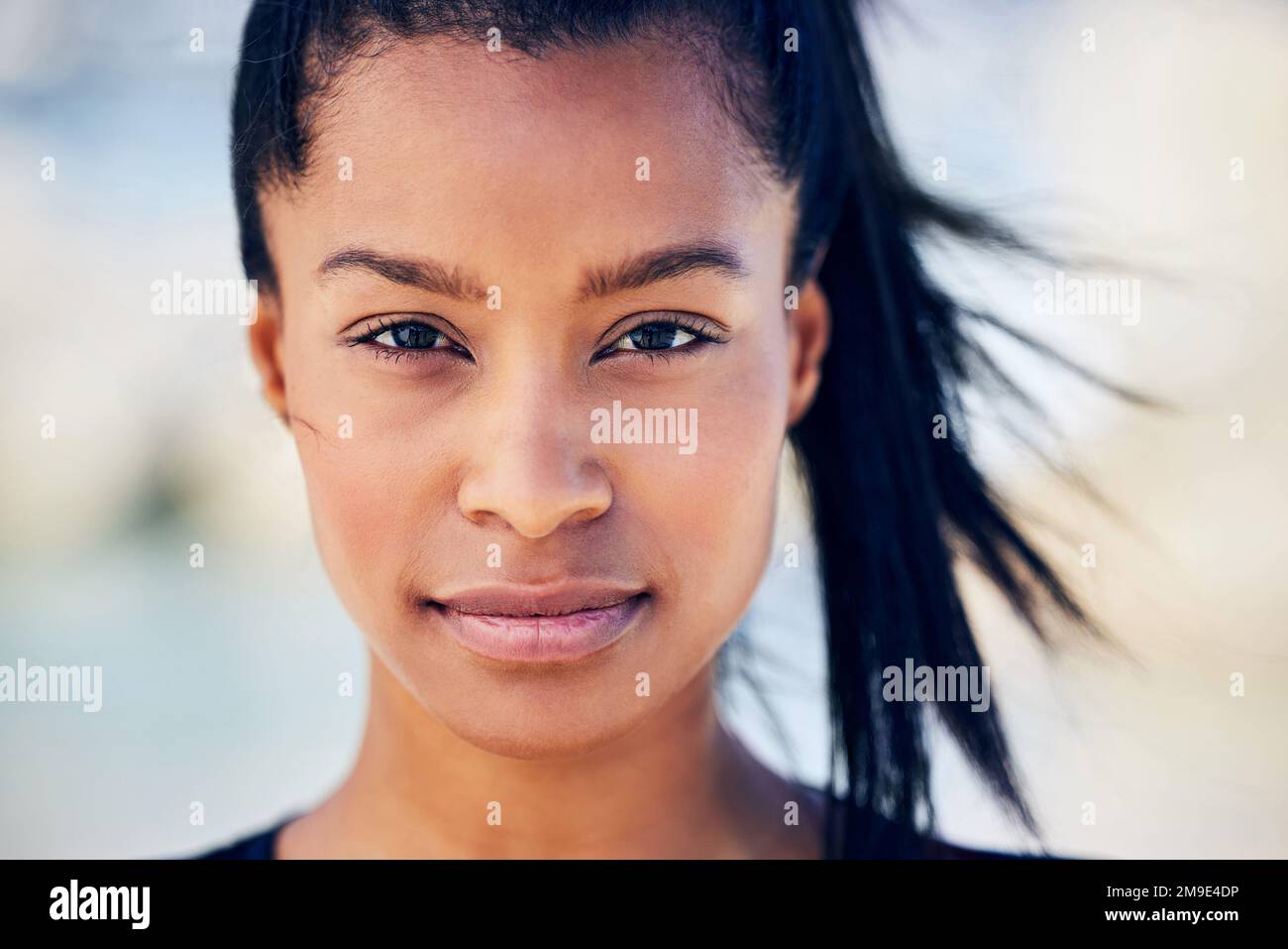 Take a chance. Closeup shot of a beautiful young woman standing outside ...