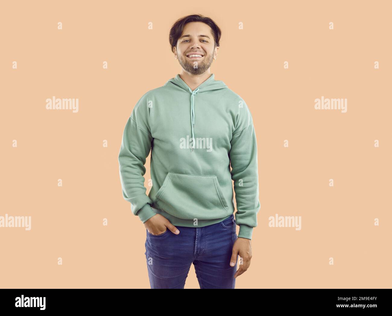Smiling cute male model on an isolated background Stock Photo - Alamy