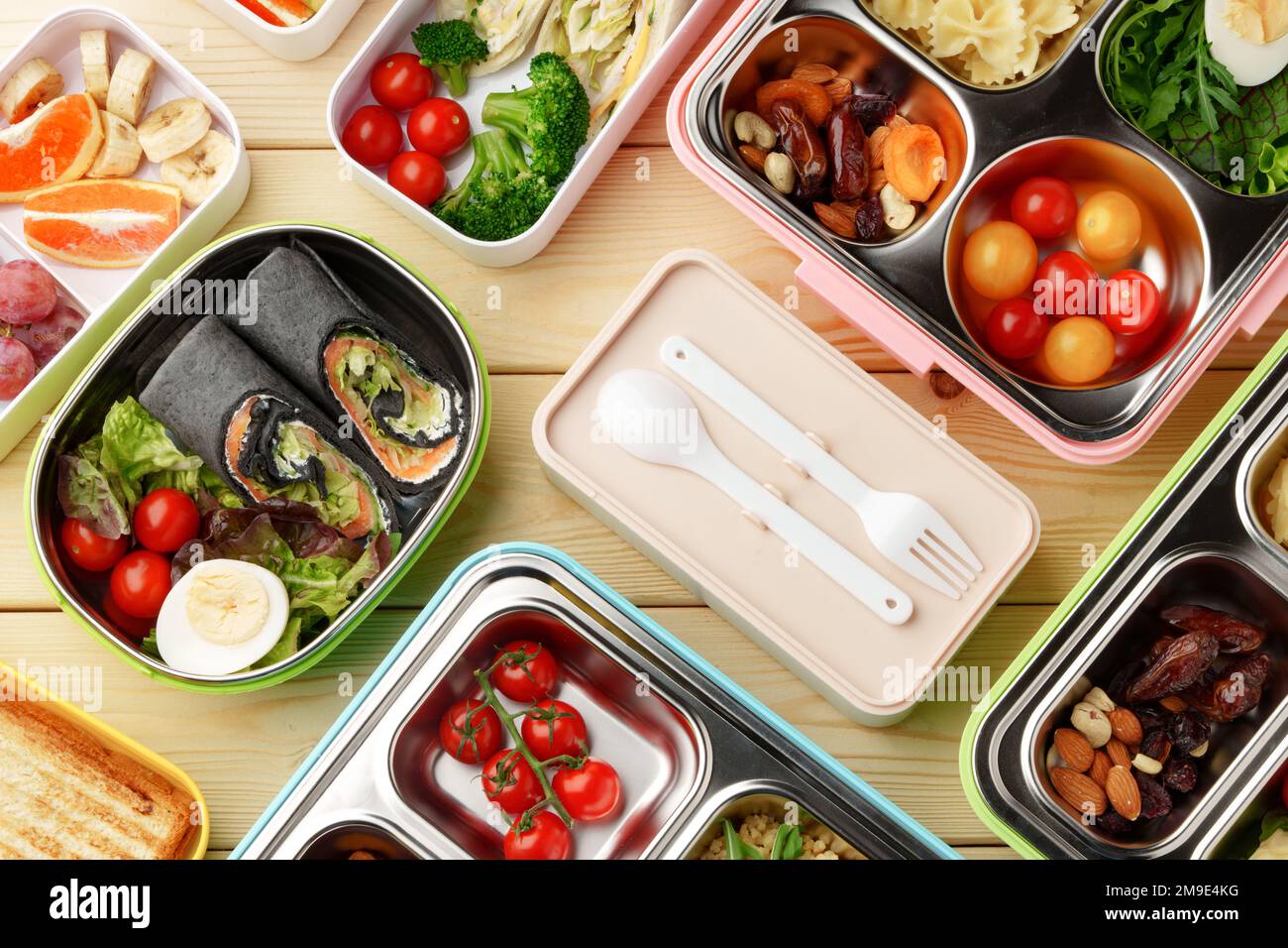 Containers with healthy food on wooden background top view Stock Photo ...