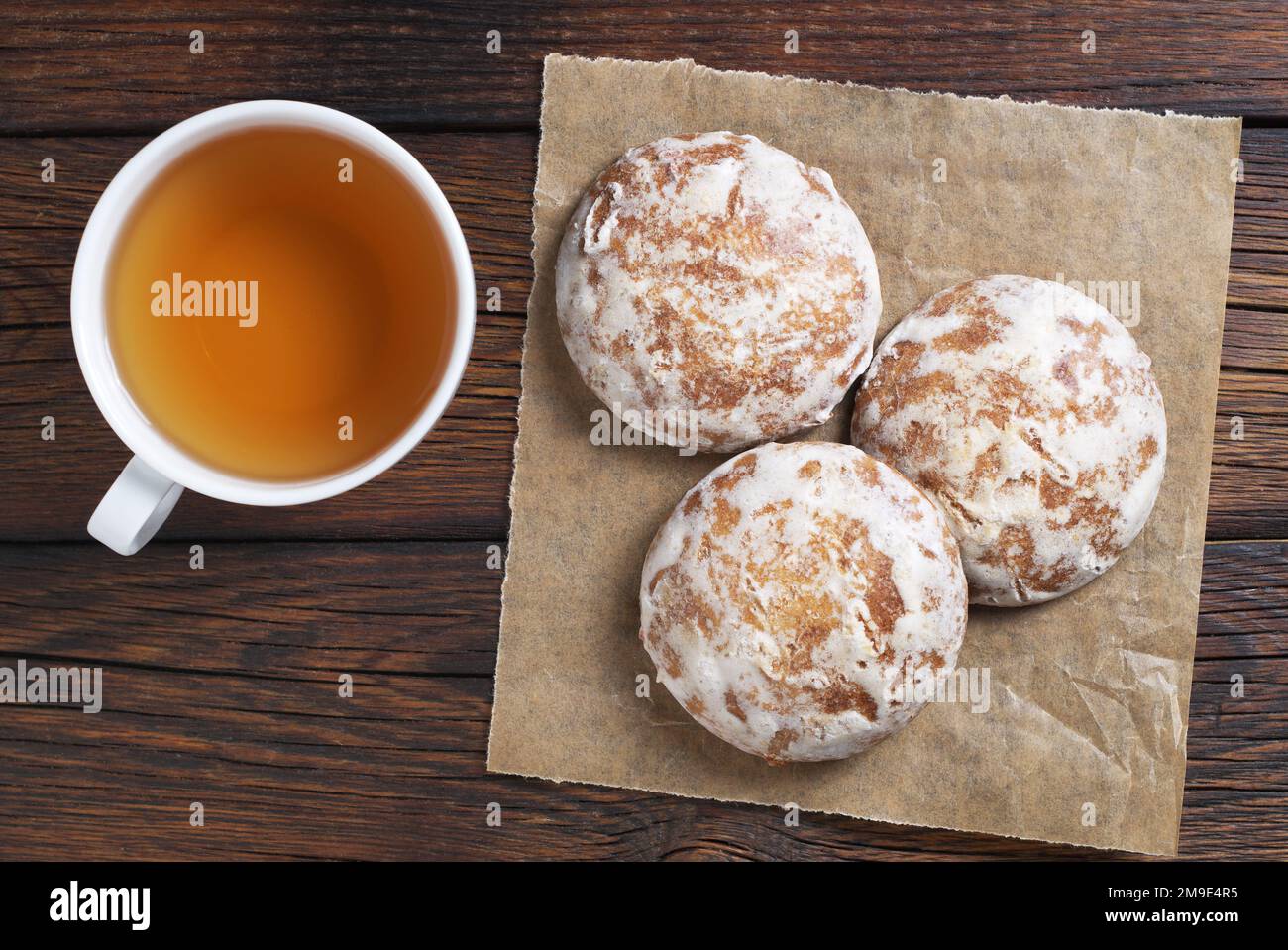 Classic Russian gingerbread cookies and cup of tea on wooden table, top ...