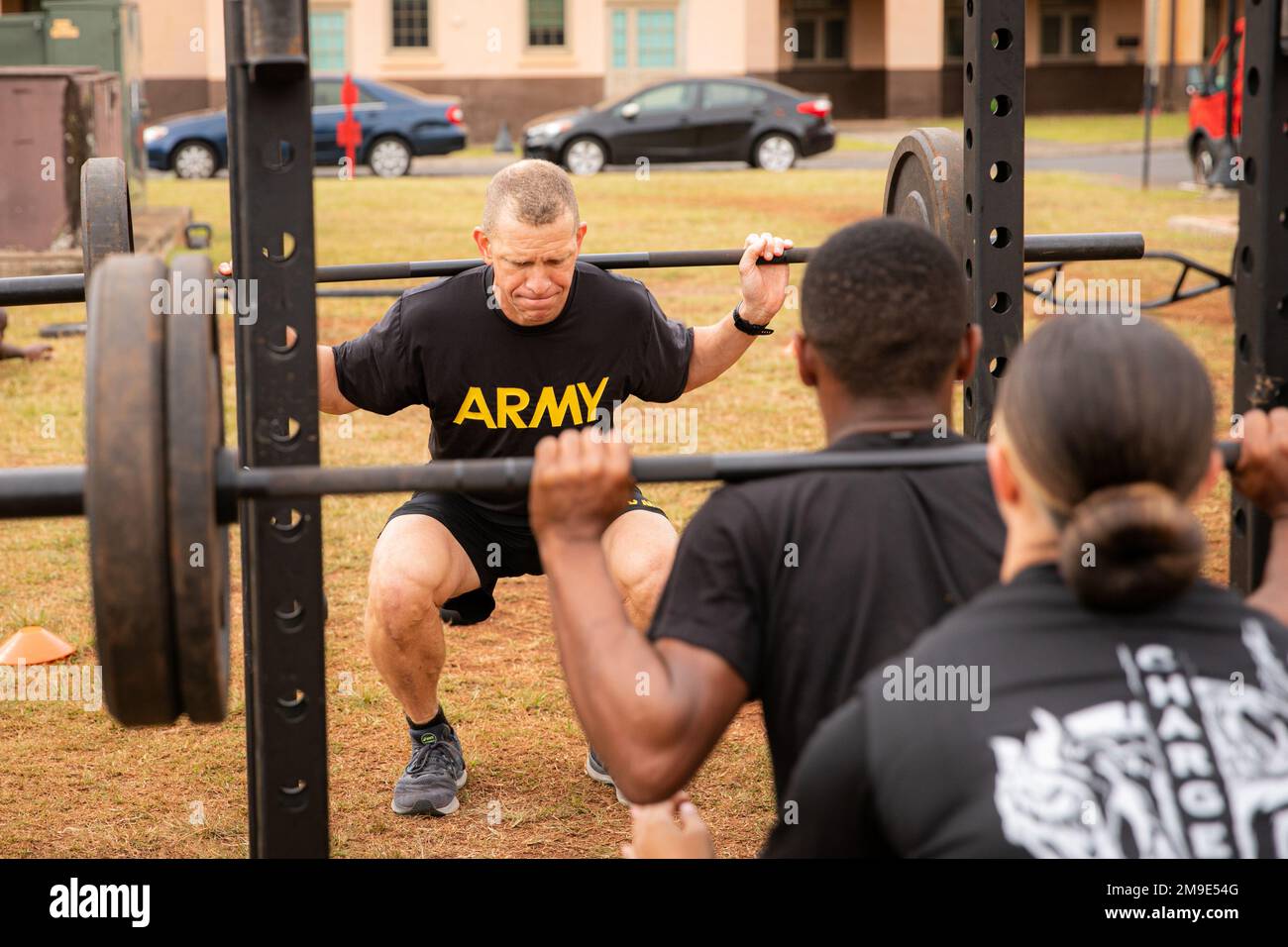Sgt. Maj. of the Army Michael A. Grinston executes a barbell back squat ...