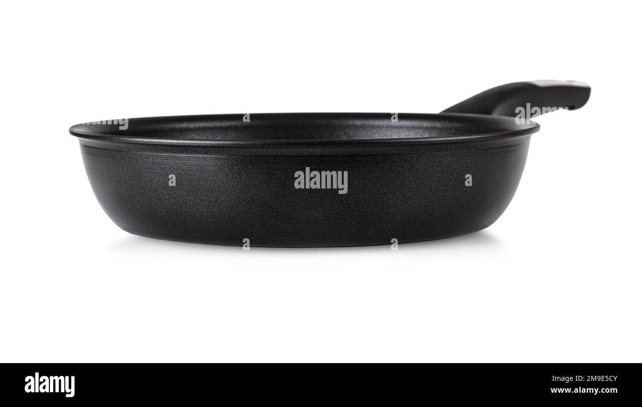 The black metal frying pan with handle isolated on white background ...