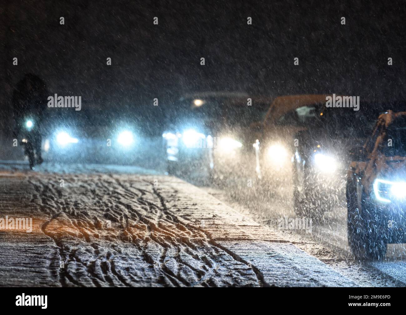Dresden, Germany. 18th Jan, 2023. Cyclists and cars cross the ...