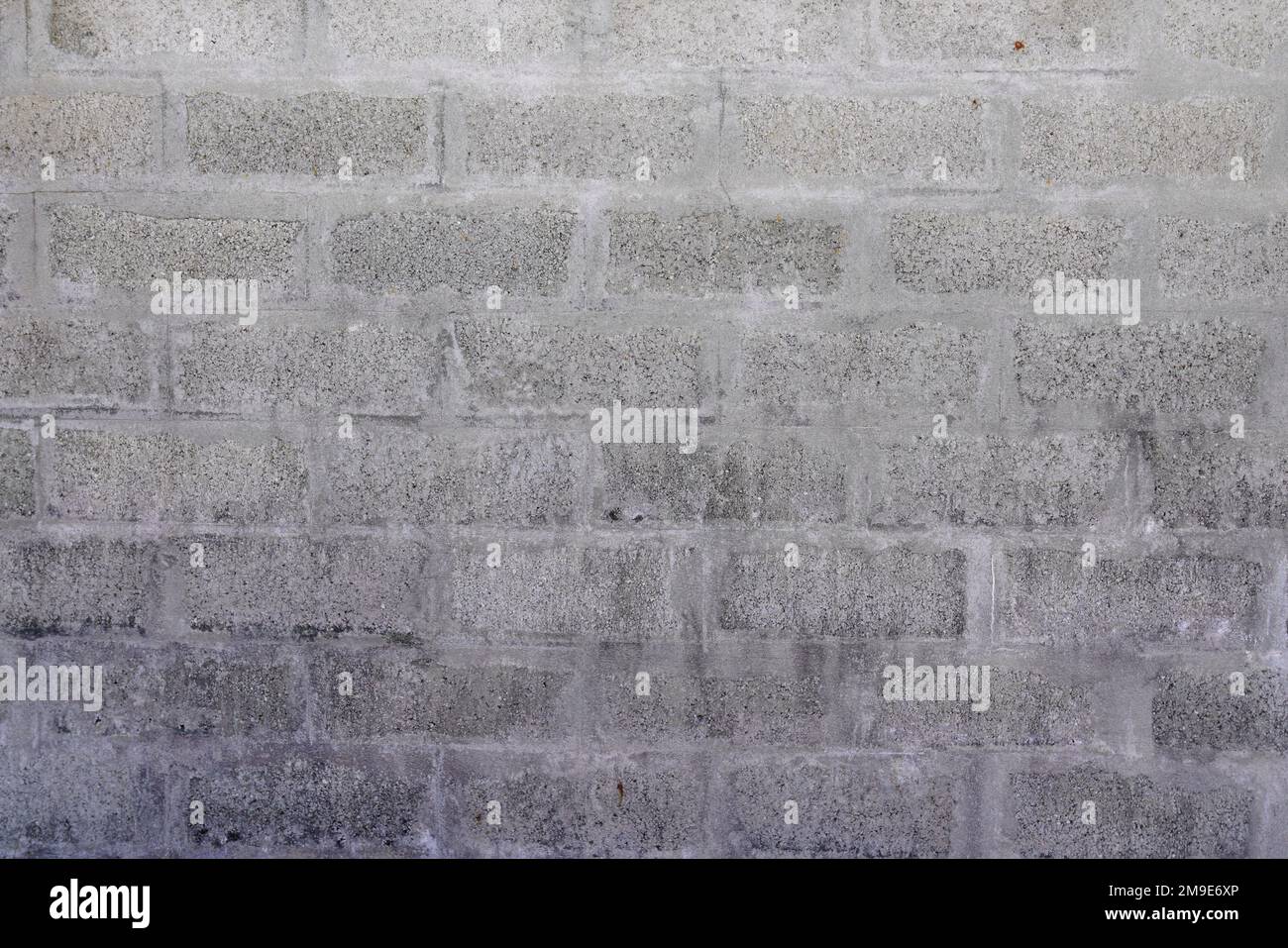 old ancient grey cinder block gray wall facade building background ...