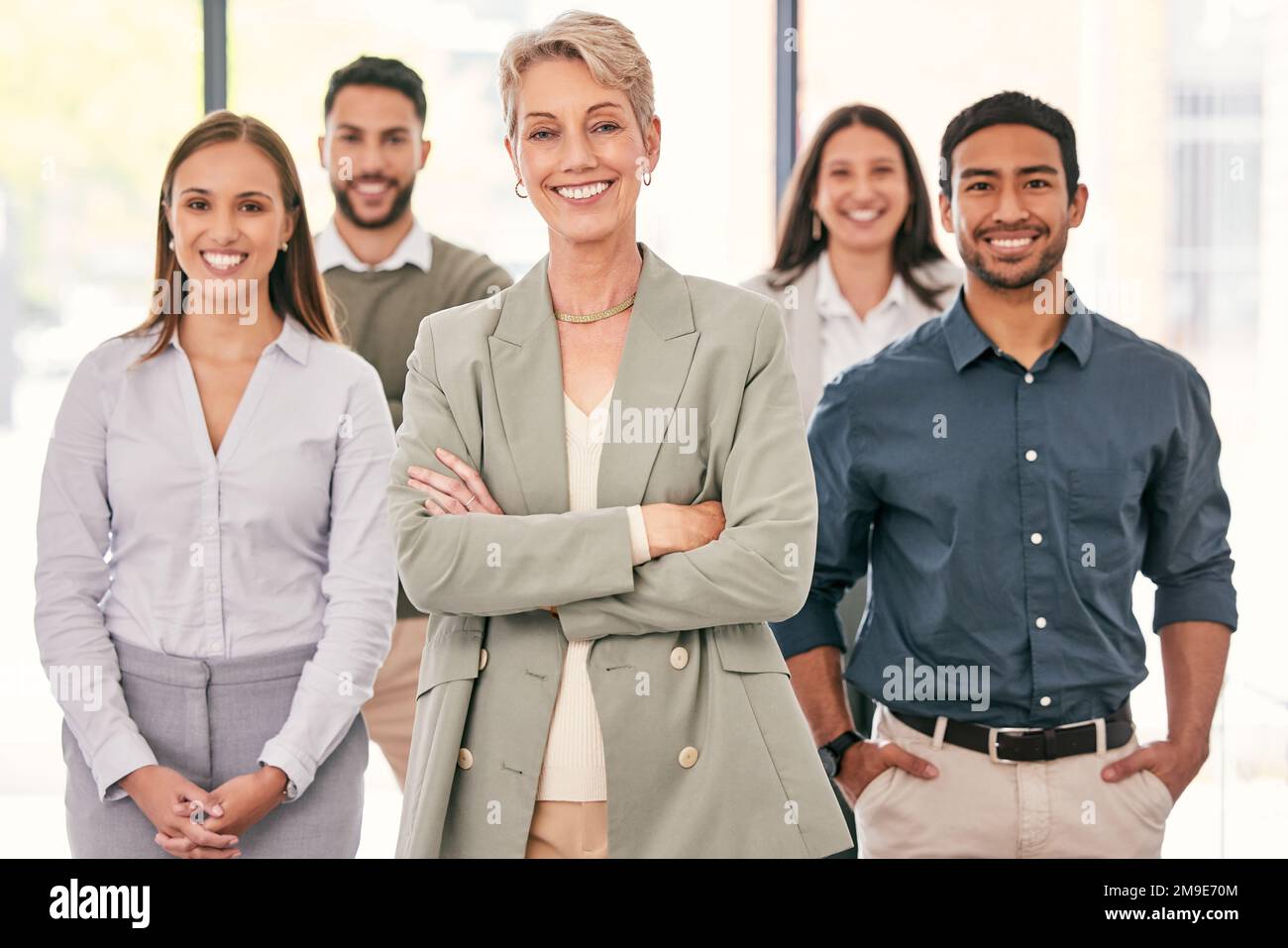 My team work hard. a diverse group of businesspeople standing together ...