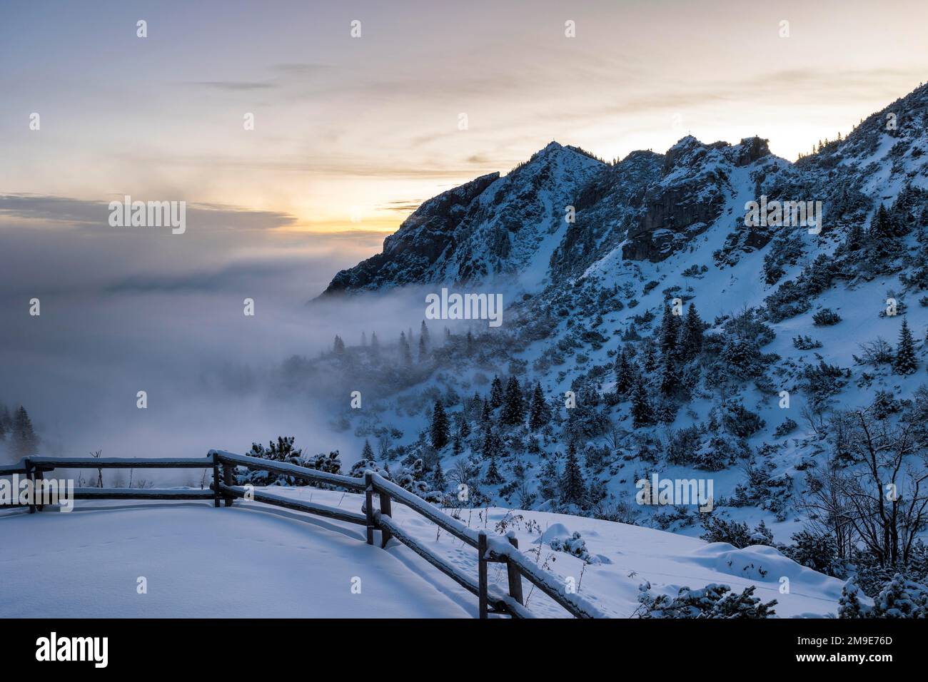 Mountain slope with snow at sunrise with clouds and clear sky and high ...