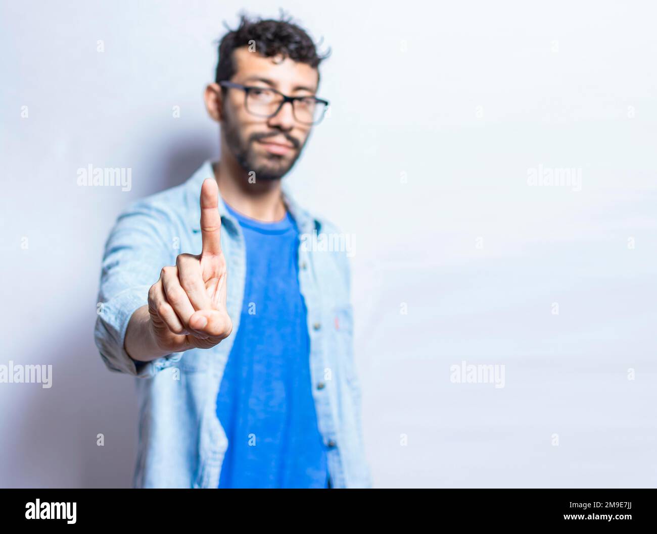 People finger counting the number one on an isolated background. Person ...