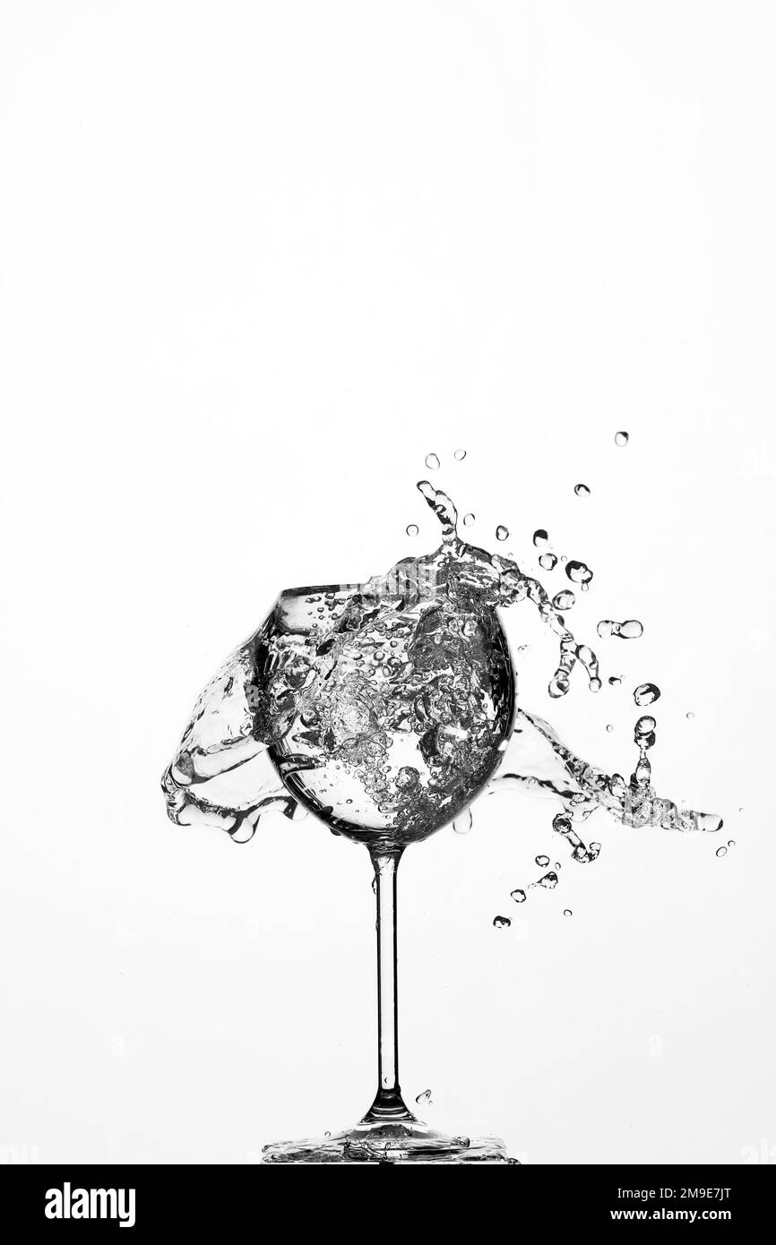 Backlight shot water fountain in glass, white background Stock Photo ...