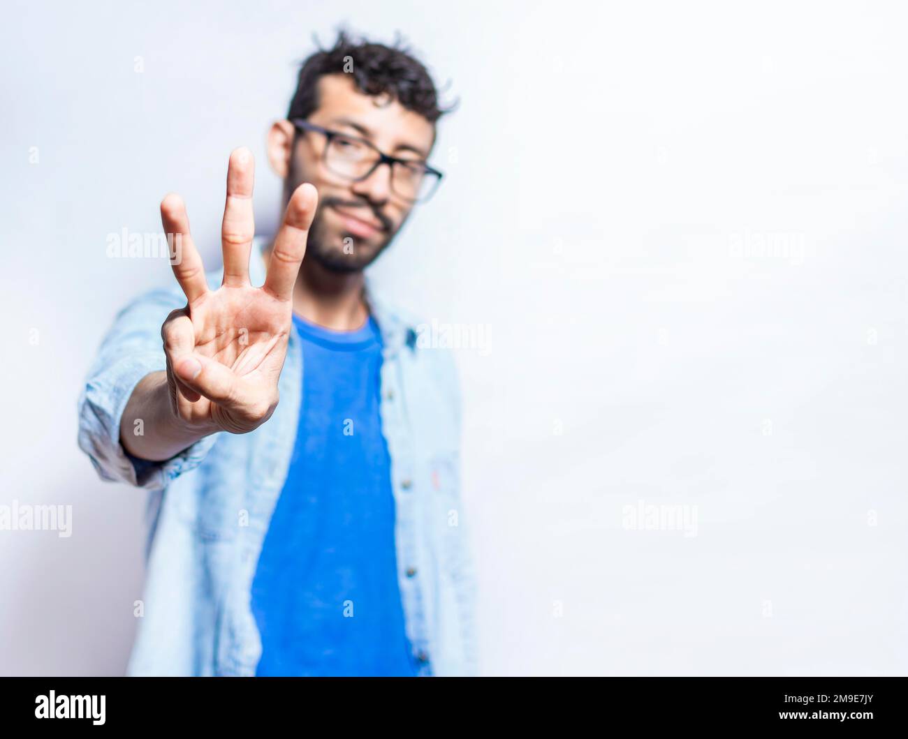 Portrait of people counting number three on isolated background. Person ...