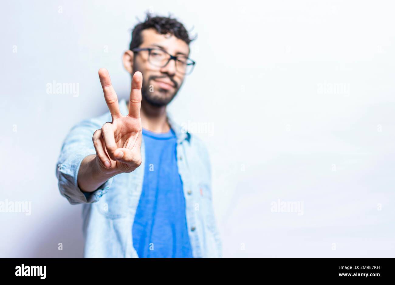 People finger counting the number two on an isolated background. Person ...