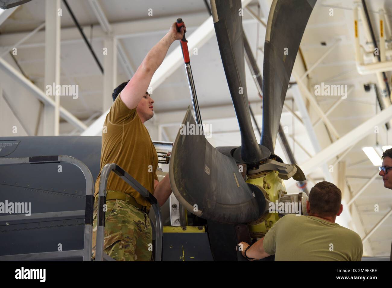 An Airman from the 79th Rescue Generation Squadron repairs an engine at ...
