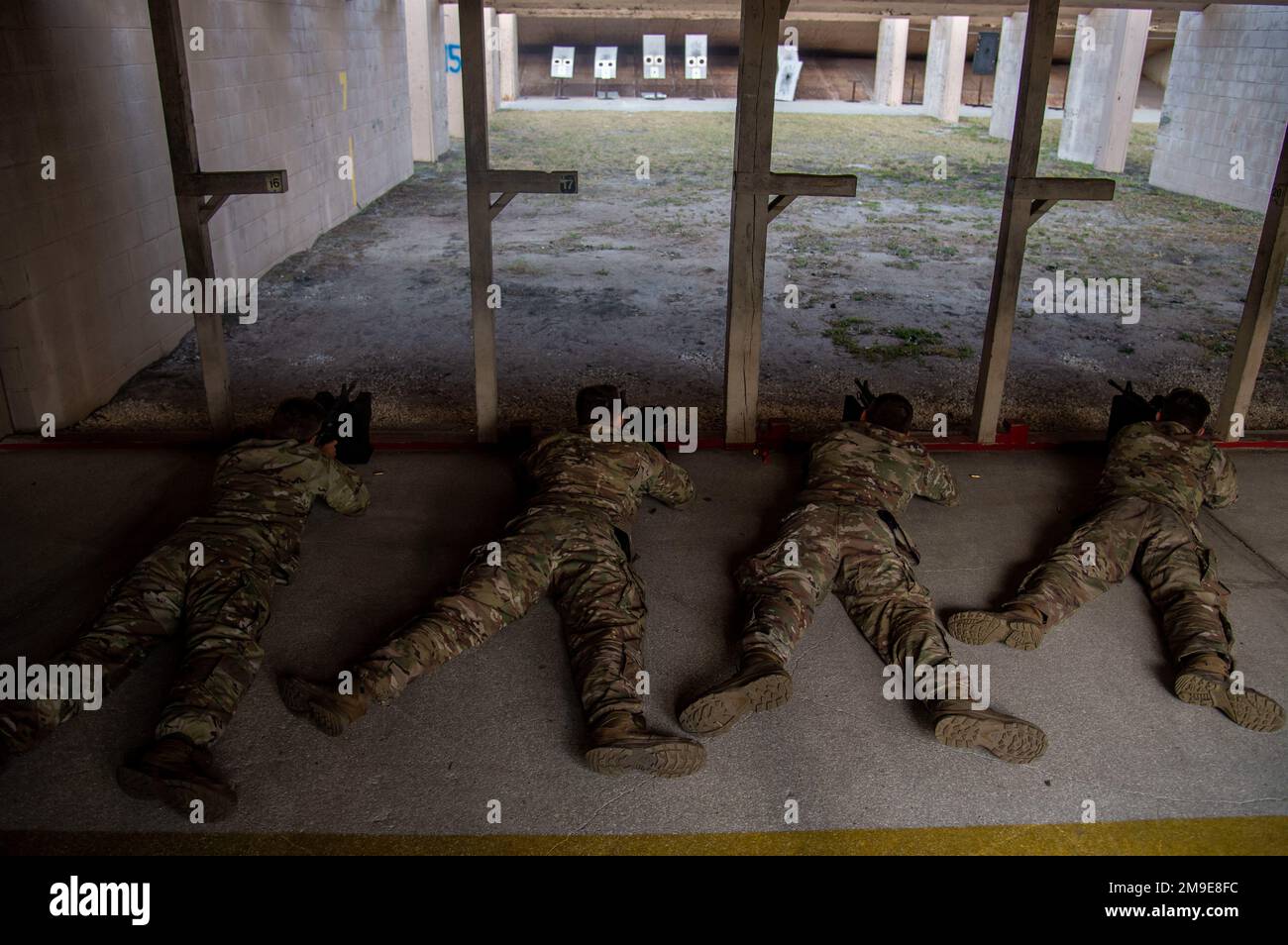 Servicemembers fire in the prone position during the rifle portion of ...