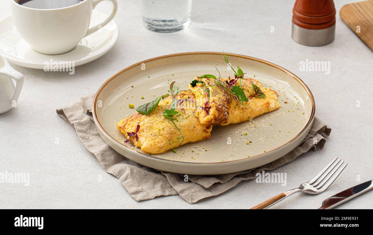 Portion of omelette with avocado and salmon Stock Photo - Alamy
