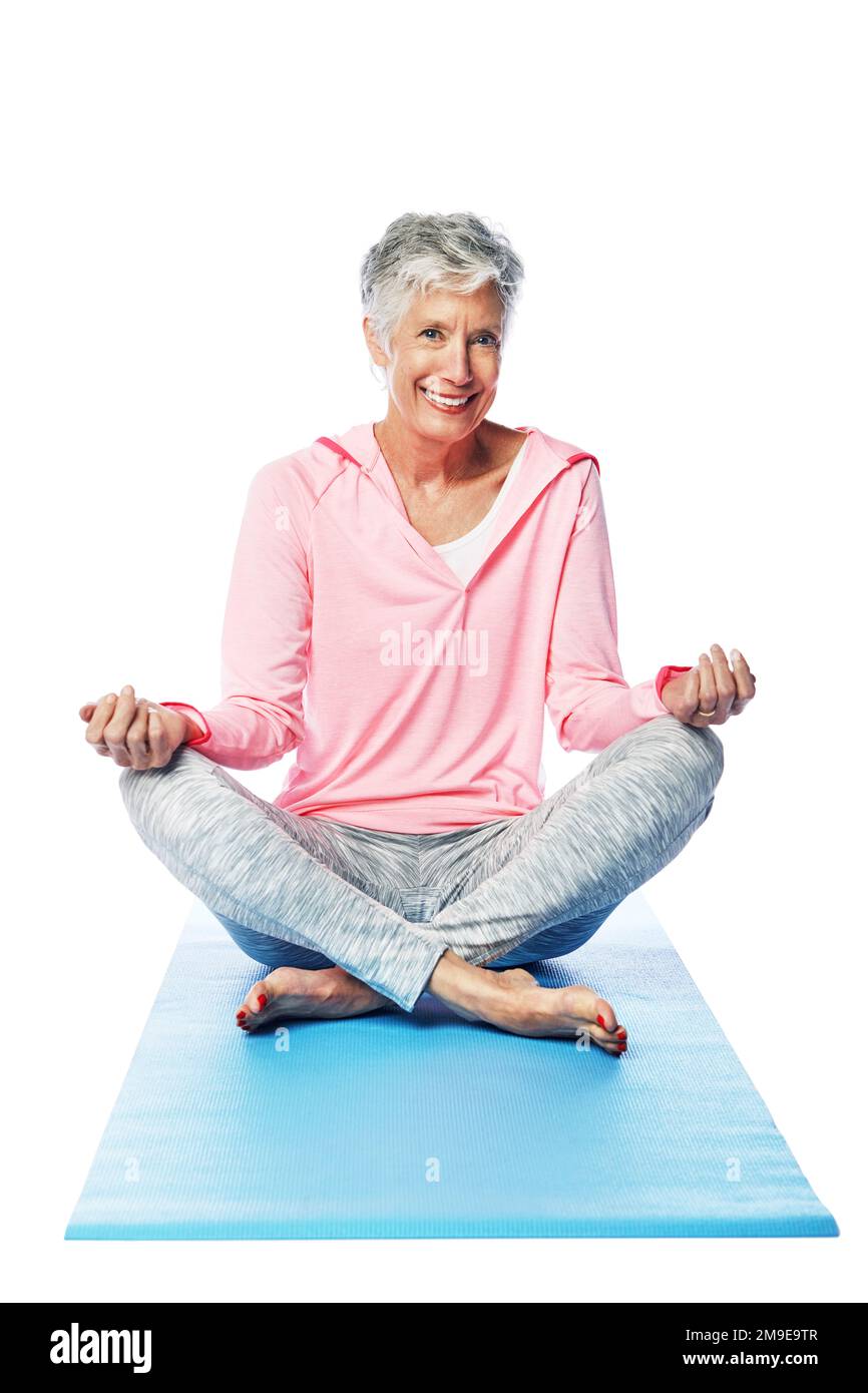 Portrait, yoga lotus and senior woman in studio isolated on a white ...