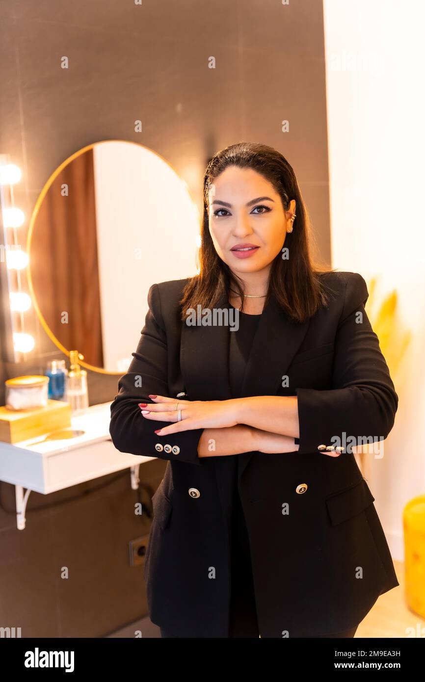 Woman of Latin ethnicity in an aesthetic store of eyebrows and nails ...