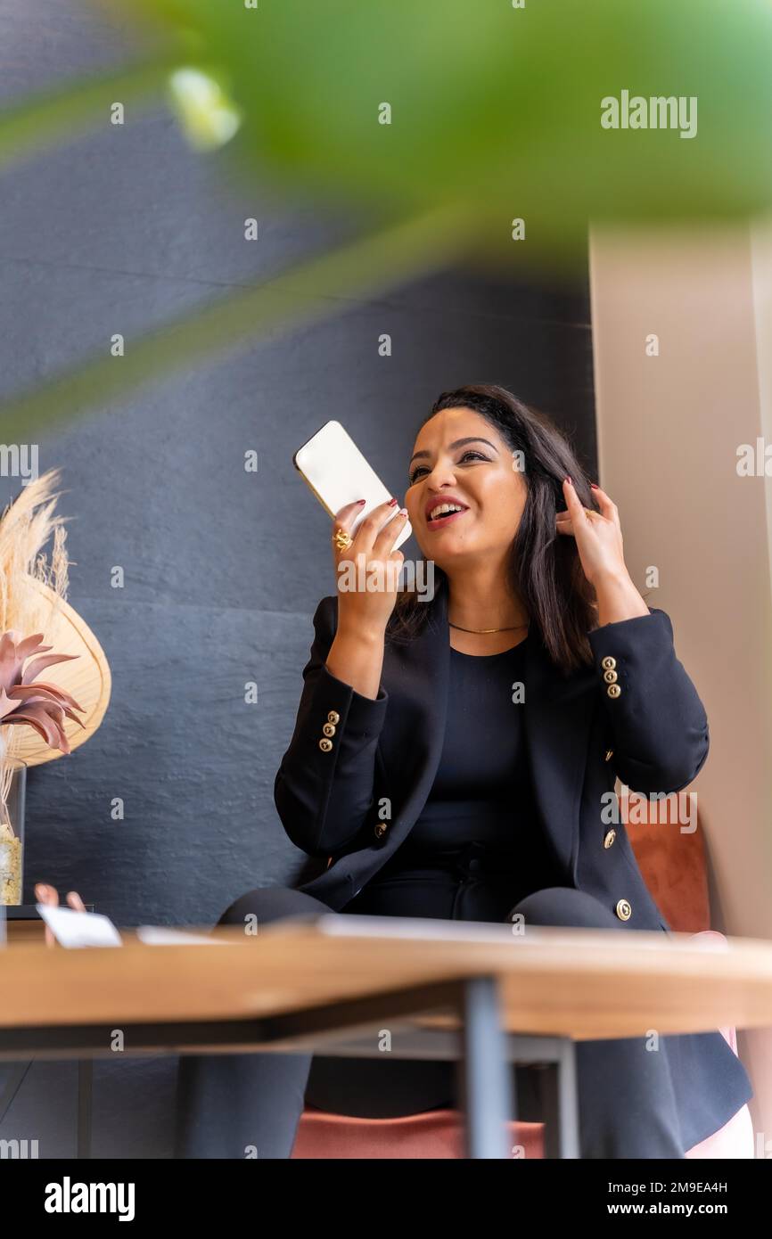 Woman of Latin ethnicity in an aesthetic store of eyebrows and nails ...