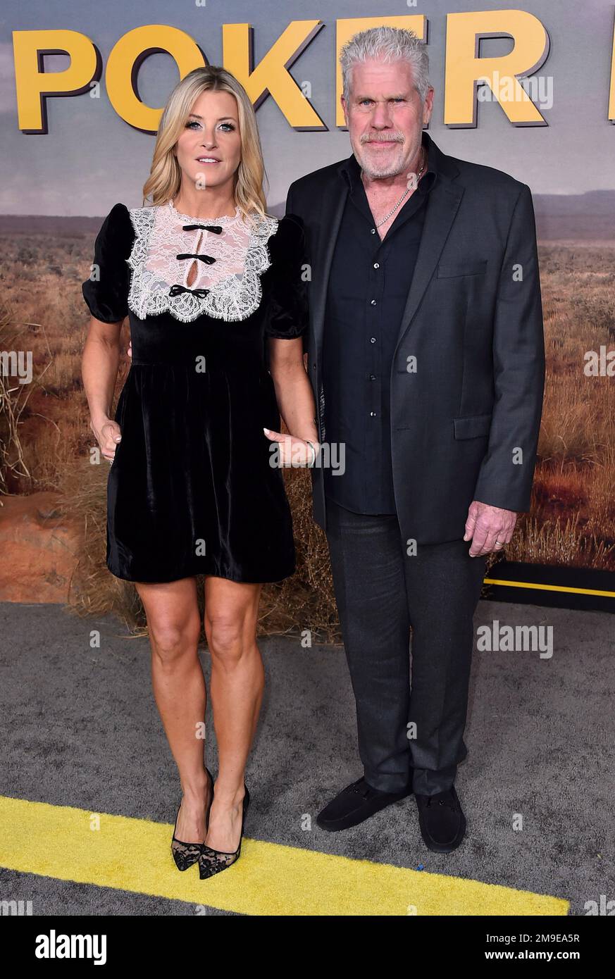 Allison Dunbar, left, and Ron Perlman arrive at the premiere of "Poker ...