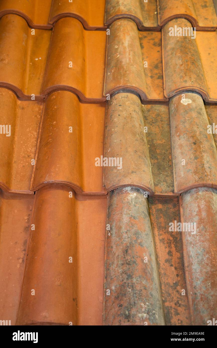 Old and new roof tiles side by side clean and dirty Stock Photo - Alamy