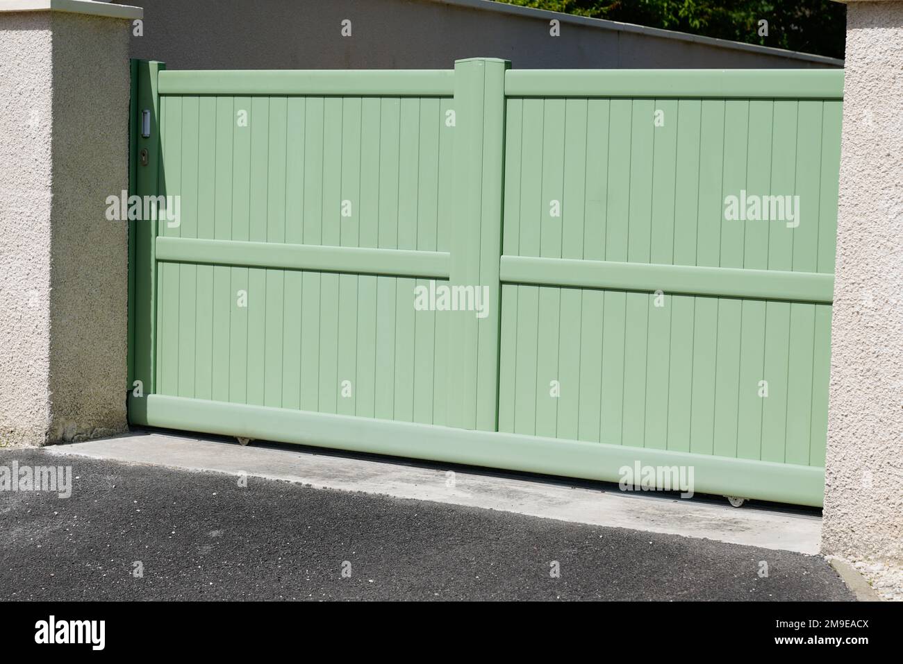 steel large green clear metal gate fence on modern house street Stock Photo - Alamy