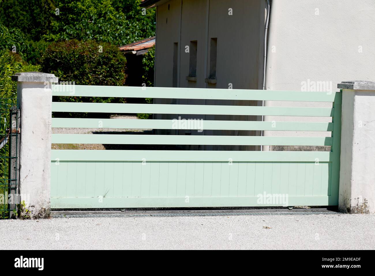 light green design metal aluminum gate of modern house Stock Photo - Alamy