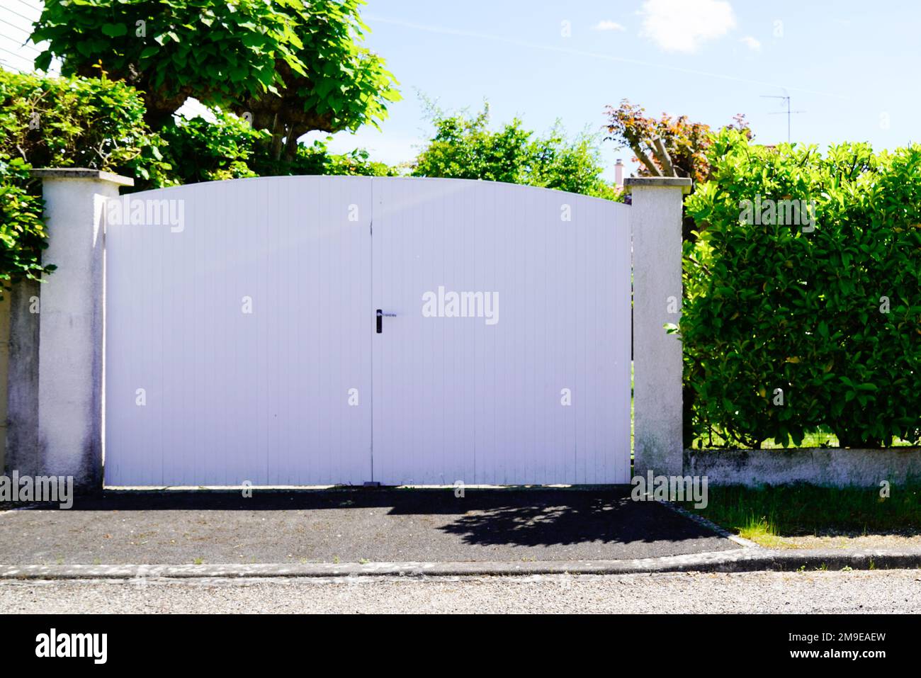 white door steel gate portal of suburb house Stock Photo - Alamy