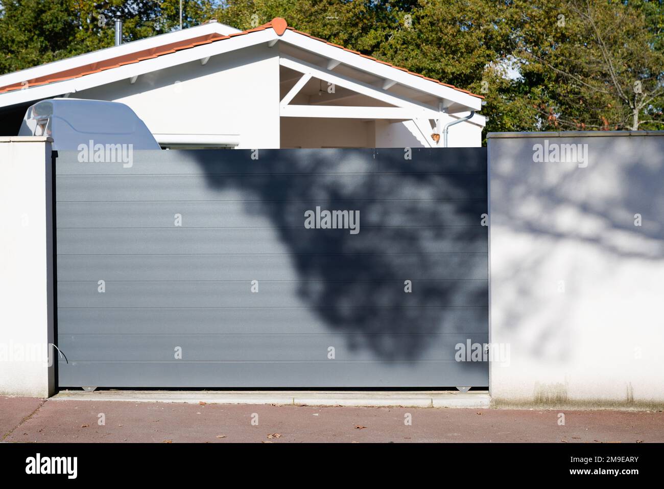 Aluminum steel grey metal gate of suburb house Stock Photo - Alamy