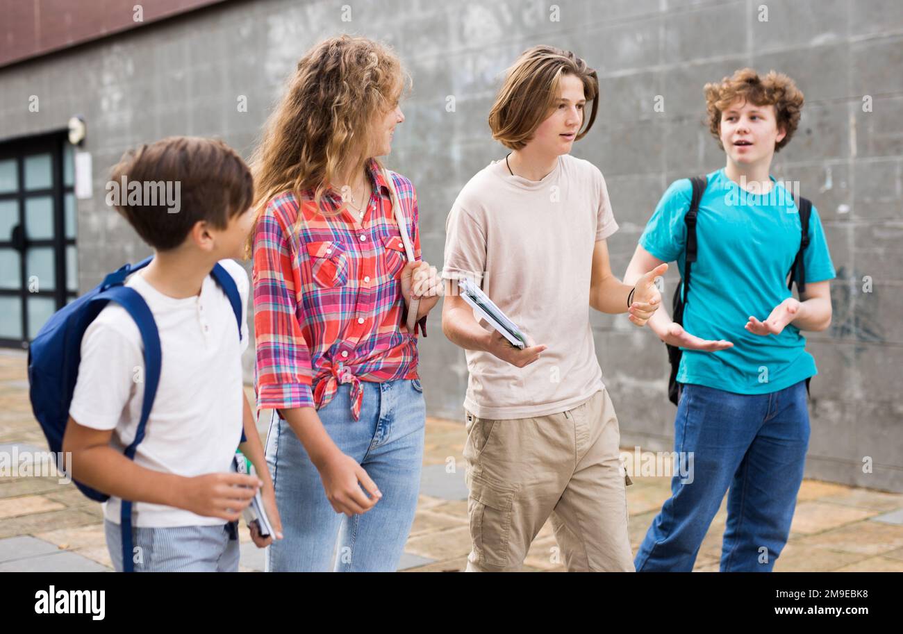School friends walk after class Stock Photo - Alamy
