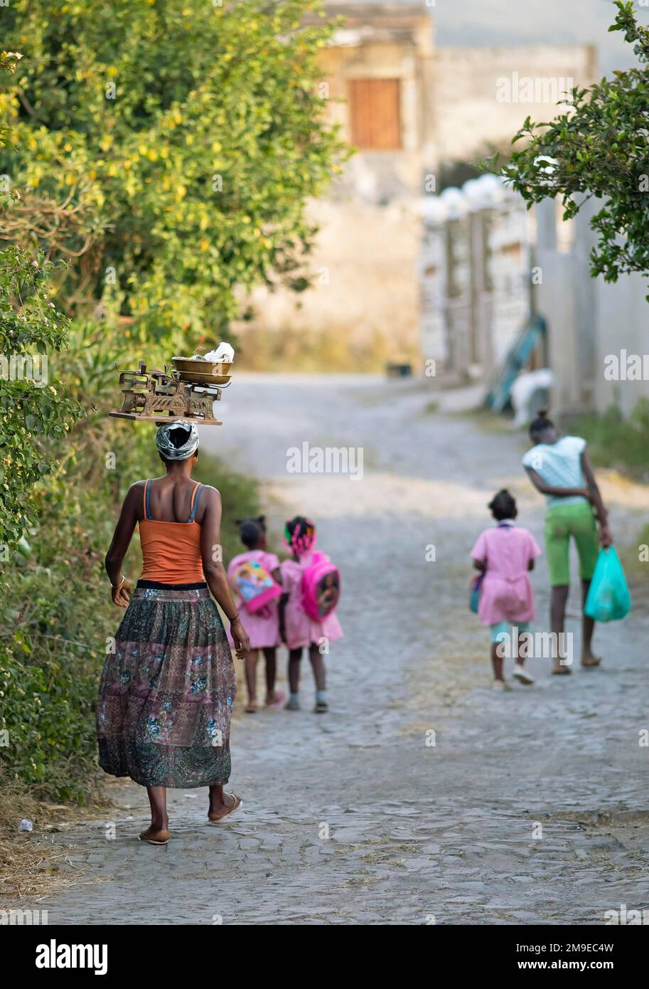 Local woman carrying a heavy object on her head, Rui Vaz, Santiago ...